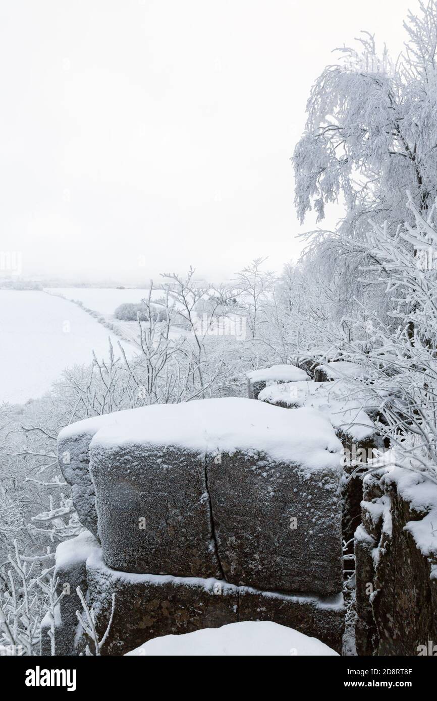 Rock Wall in winter landscape Stock Photo - Alamy