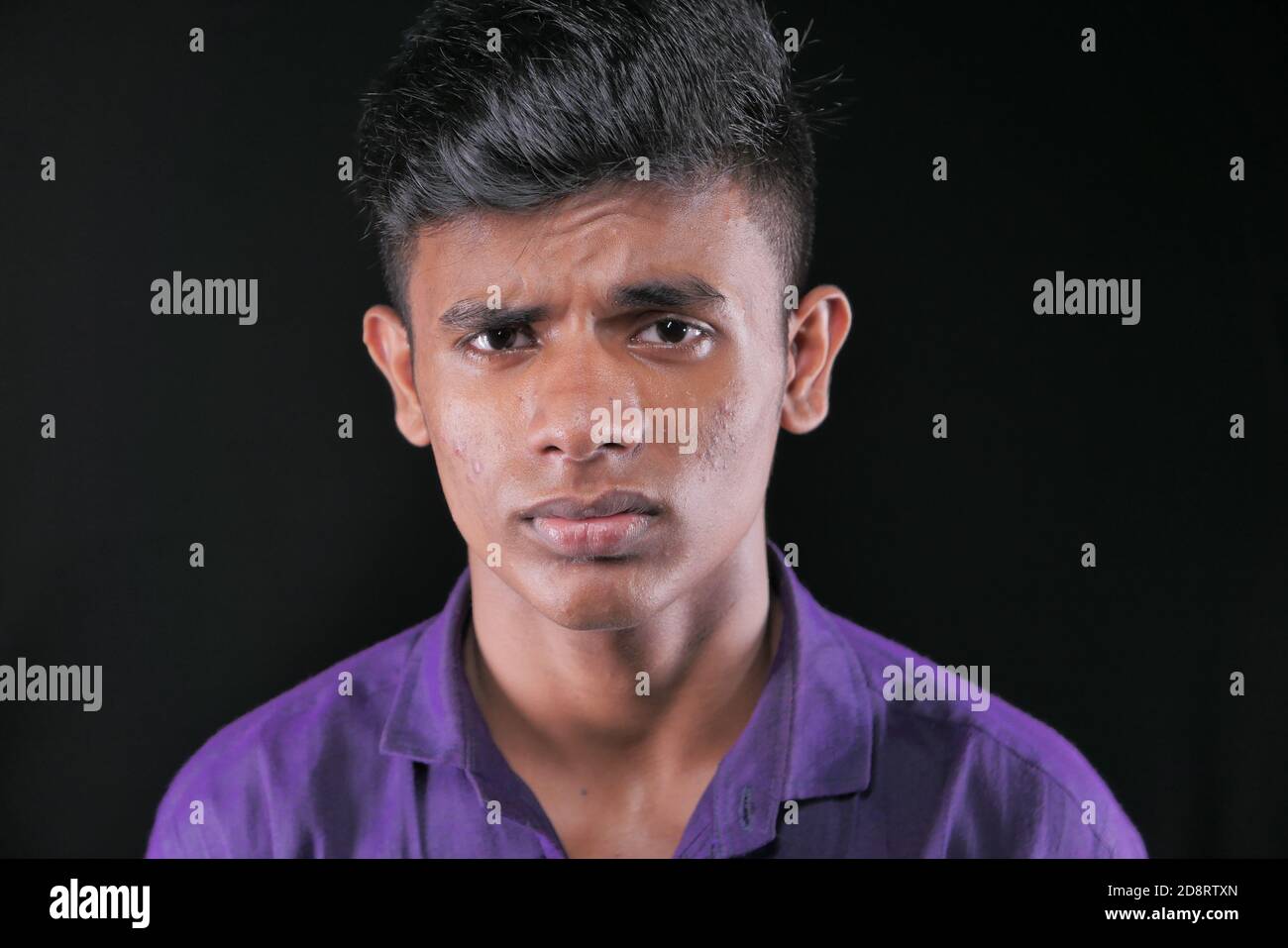 portrait of sad man isolated on black background Stock Photo - Alamy
