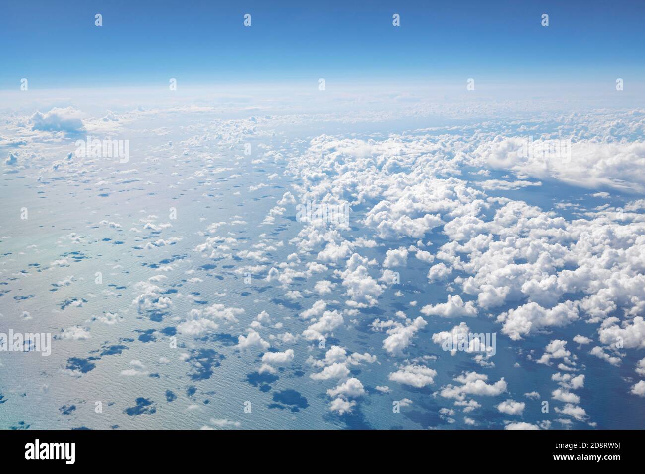 Atlantic ocean aerial view with blue sky, horizon and fluffy white ...