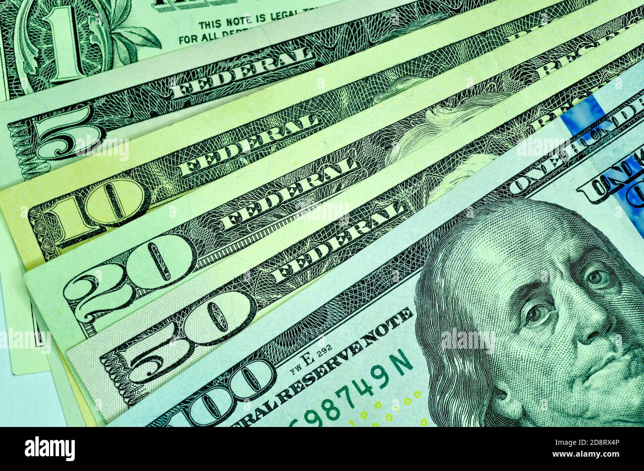 Top view of one, five, twenty, ten, fifty and hundred-dollar banknotes ...