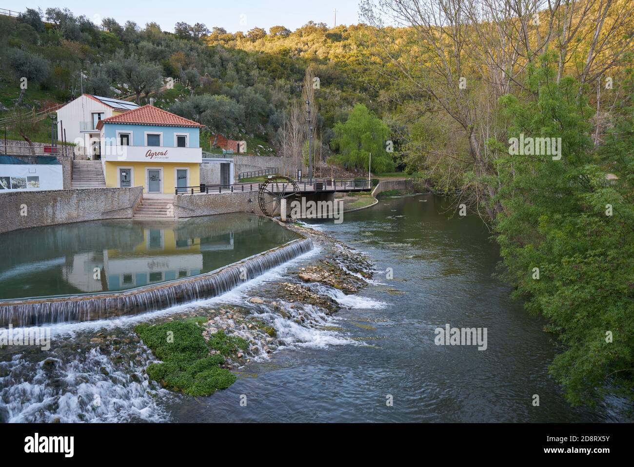 Agroal river fluvial beach with a waterfall and water mill in Portugal ...