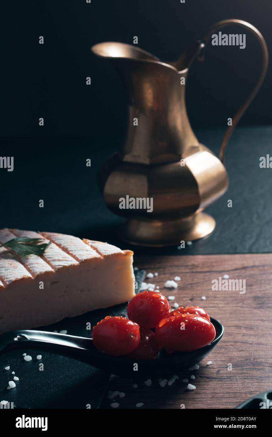 Closeup of the traditional French Brie cheese with fresh tomatoes Stock ...