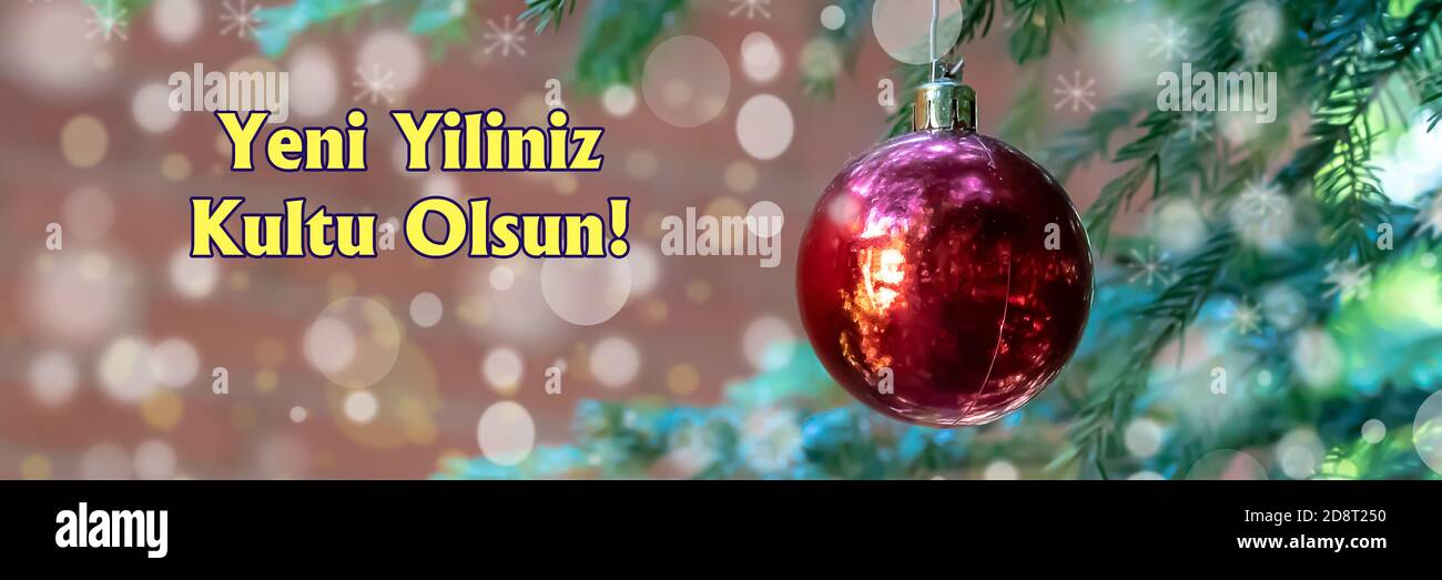 The greeting text in Turkish means Happy New Year. Blurred background ...