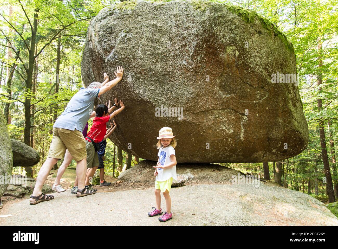 The famous shaking rock near Saldenburg is a popular spot with hikers ...