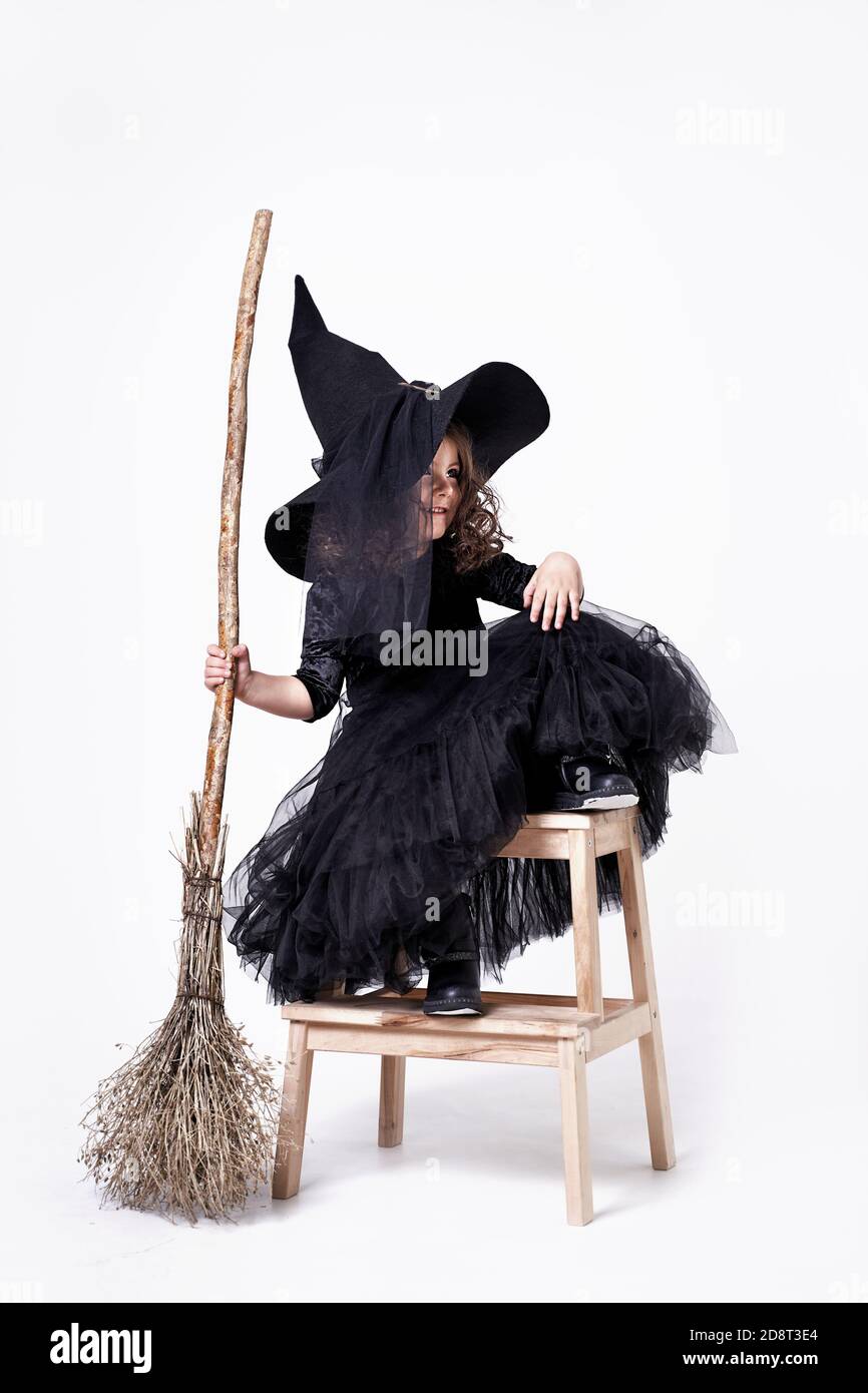 funny witch girl on white background with broom on white background ...
