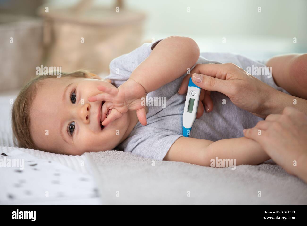 Taking temperature baby doctor hi-res stock photography and images - Alamy
