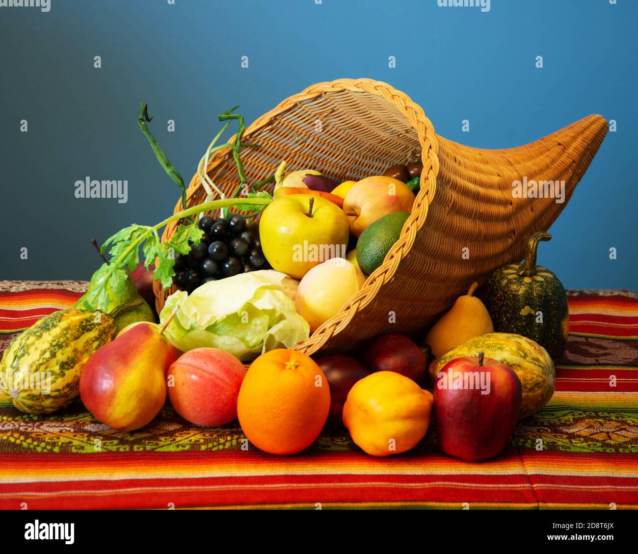 Fruit and Vegetables in wood Cornucopia on table Stock Photo - Alamy