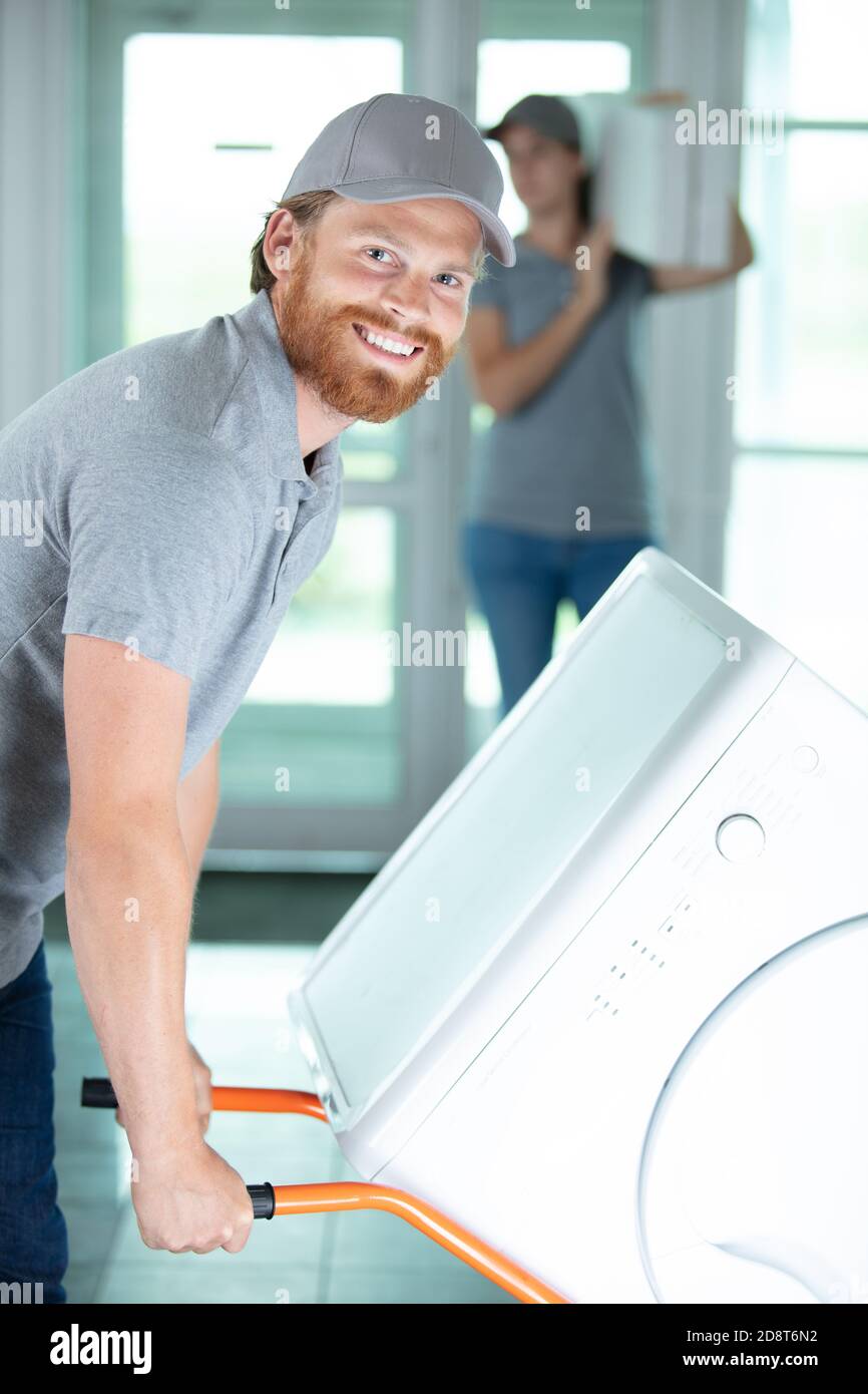 Man carrying washing machine hi-res stock photography and images - Alamy
