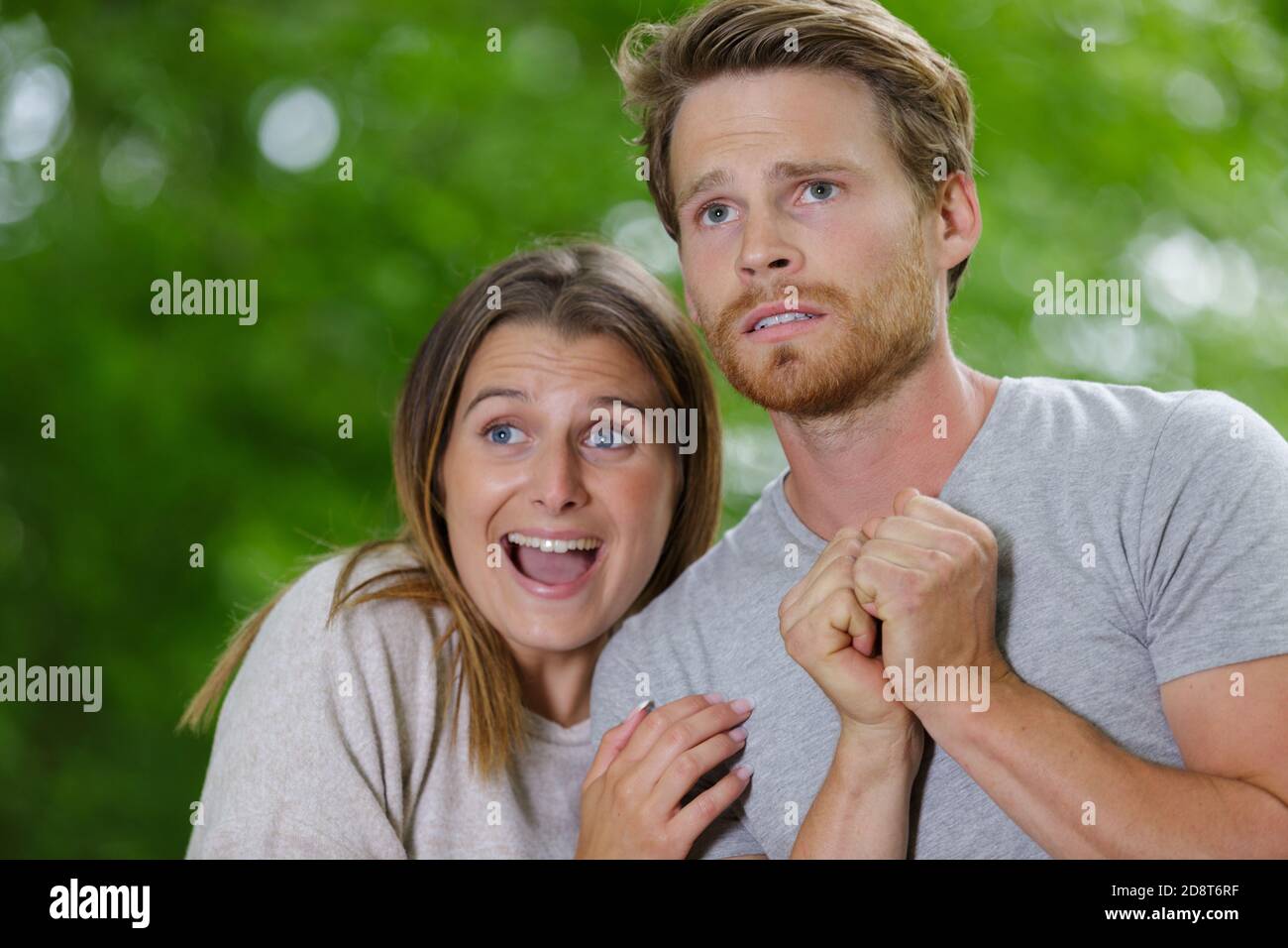 scared young couple in safari suits in jungle Stock Photo - Alamy