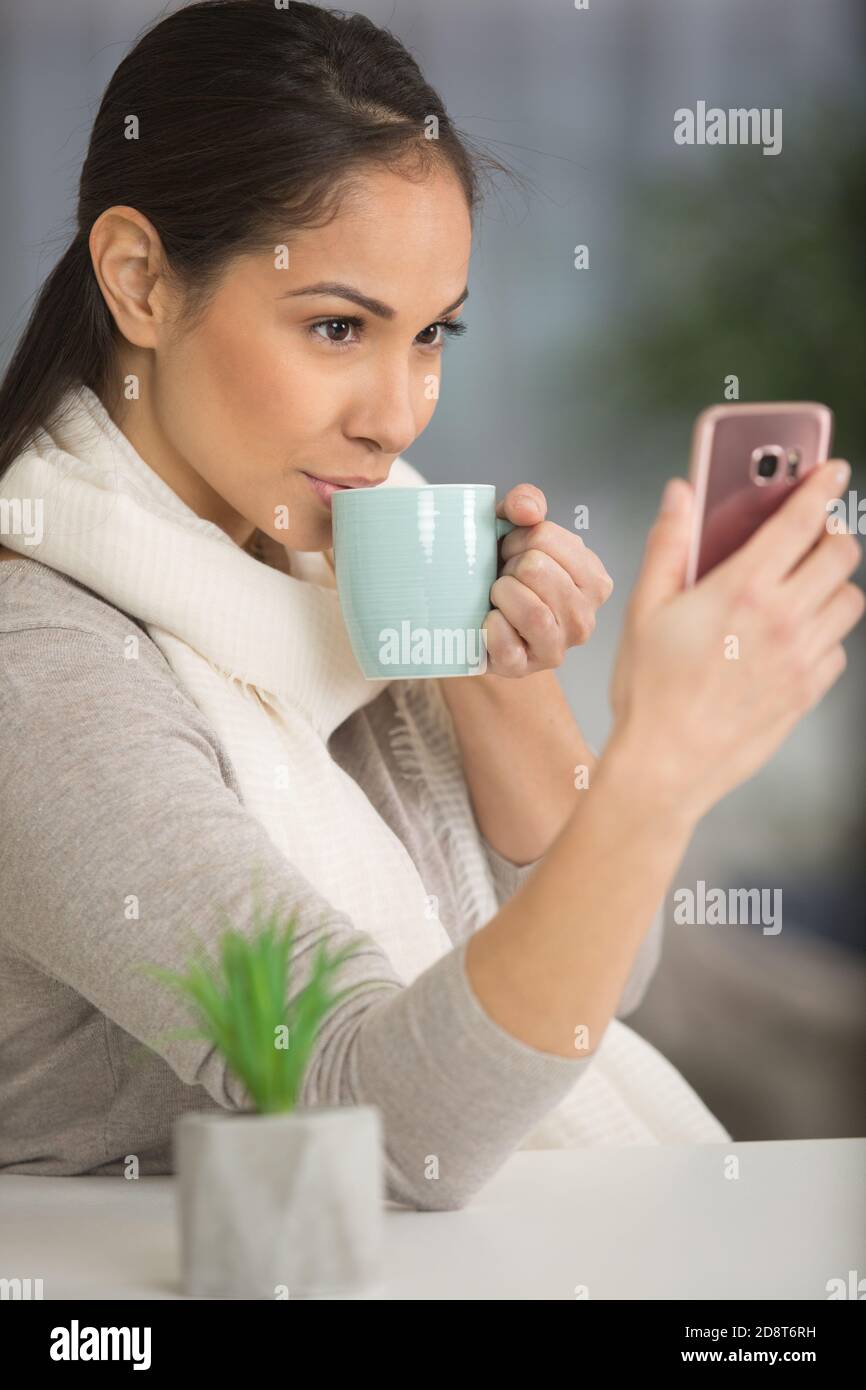 woman with cup of coffee doing a selfie Stock Photo - Alamy