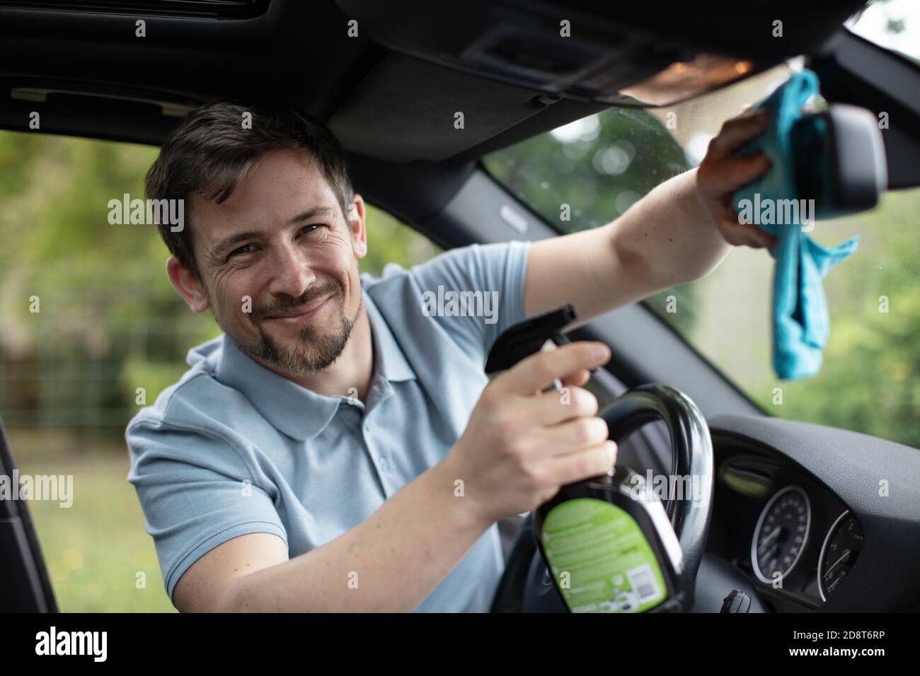 man with rag washing mirror of car Stock Photo - Alamy