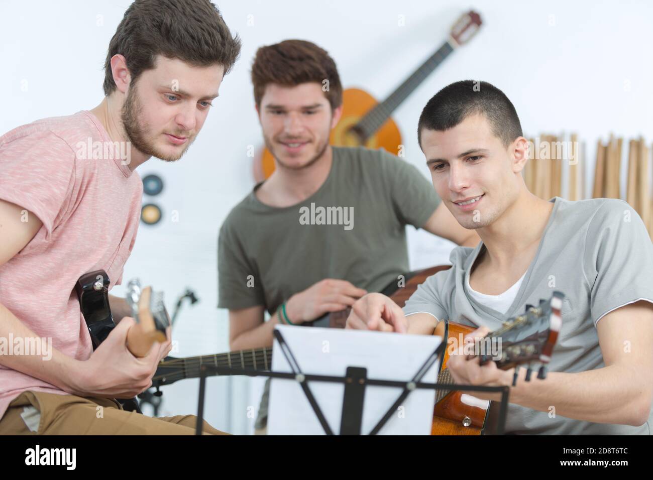 three musicians in the creative prosess of writing a song Stock Photo ...