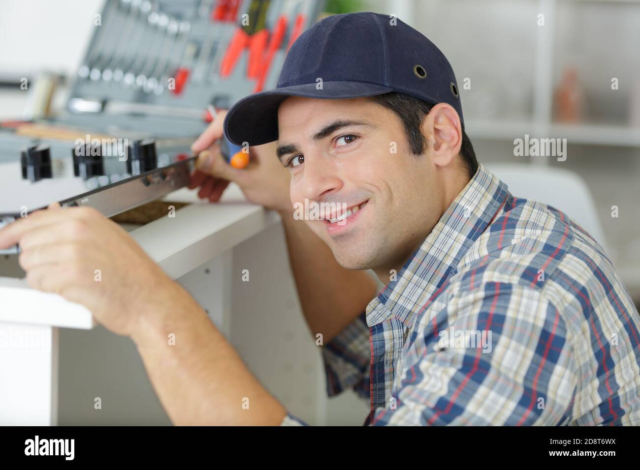 Construction worker installing stainless hi-res stock photography and ...