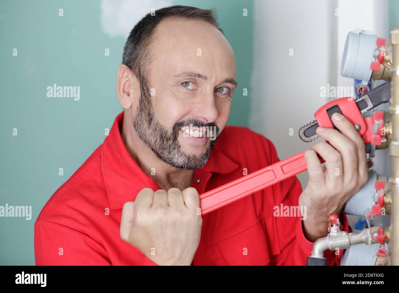 man repair the washing machine out of order Stock Photo - Alamy