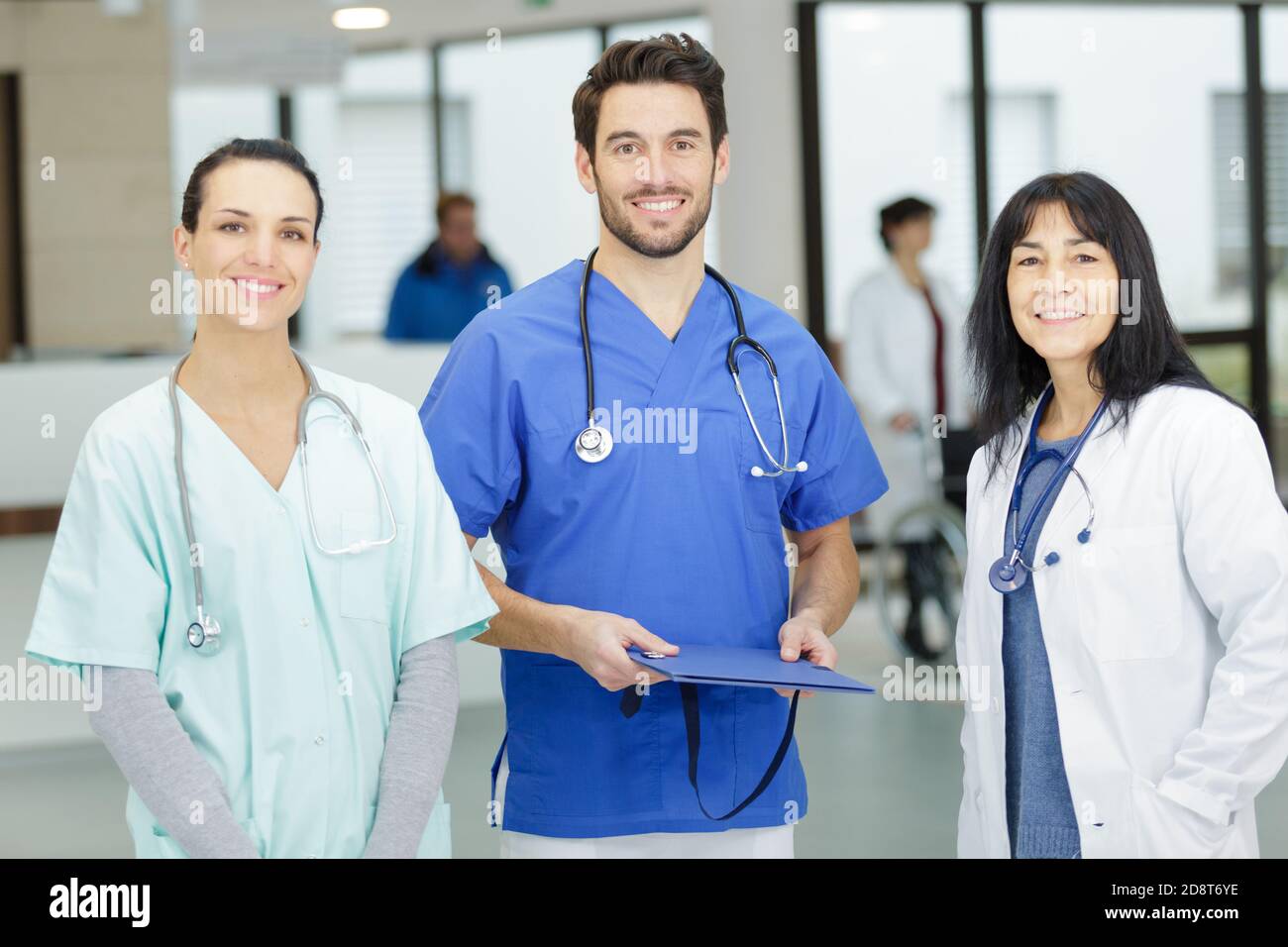 portrait of medical team standing in hospital corridor Stock Photo - Alamy
