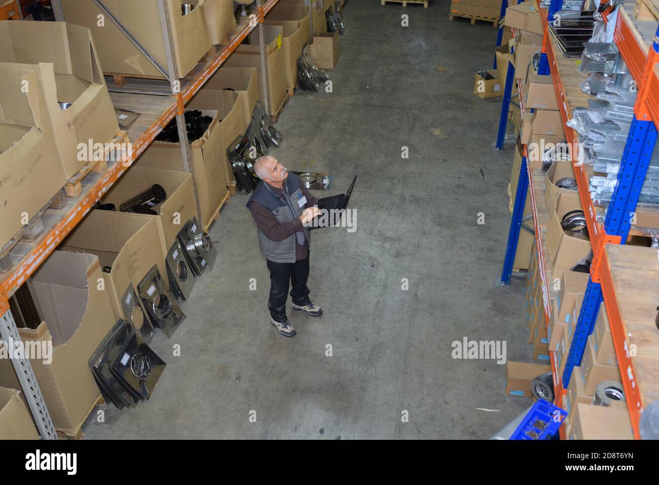 senior worker in warehouse Stock Photo - Alamy