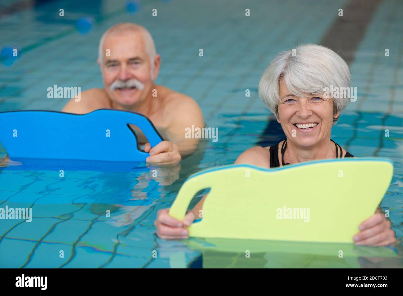senior happy couple in swimming pool Stock Photo - Alamy