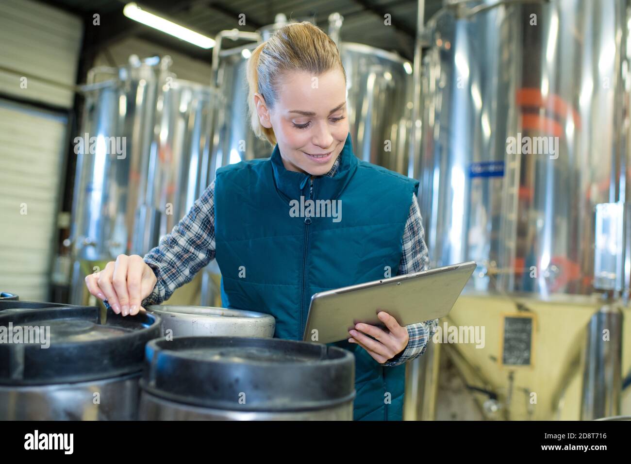 female worker at a beer factory Stock Photo - Alamy