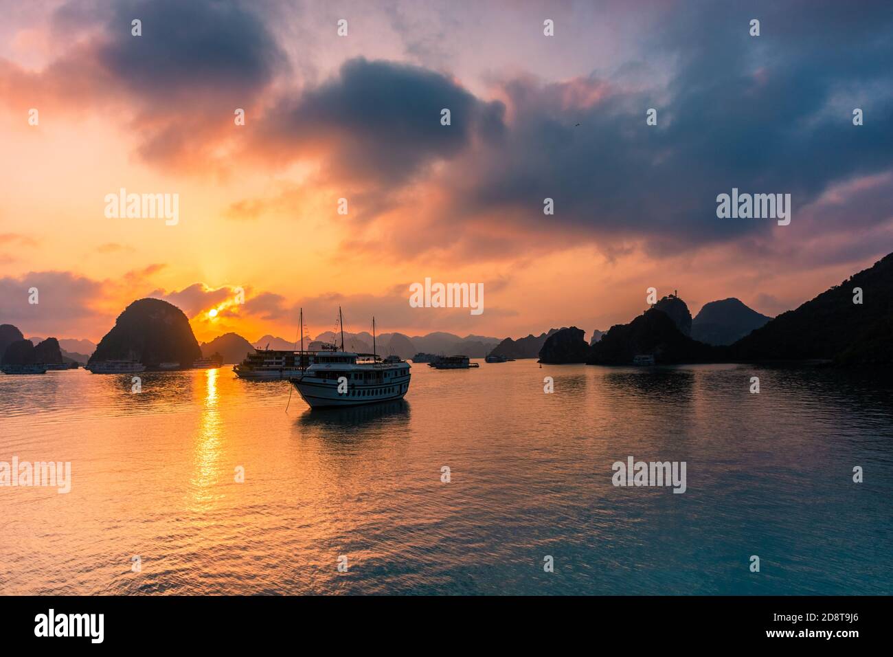 Amazing sunset over Ha Long Bay, Vietnam Stock Photo - Alamy