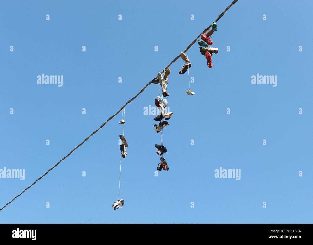 Shoes hanging from light hi-res stock photography and images - Alamy