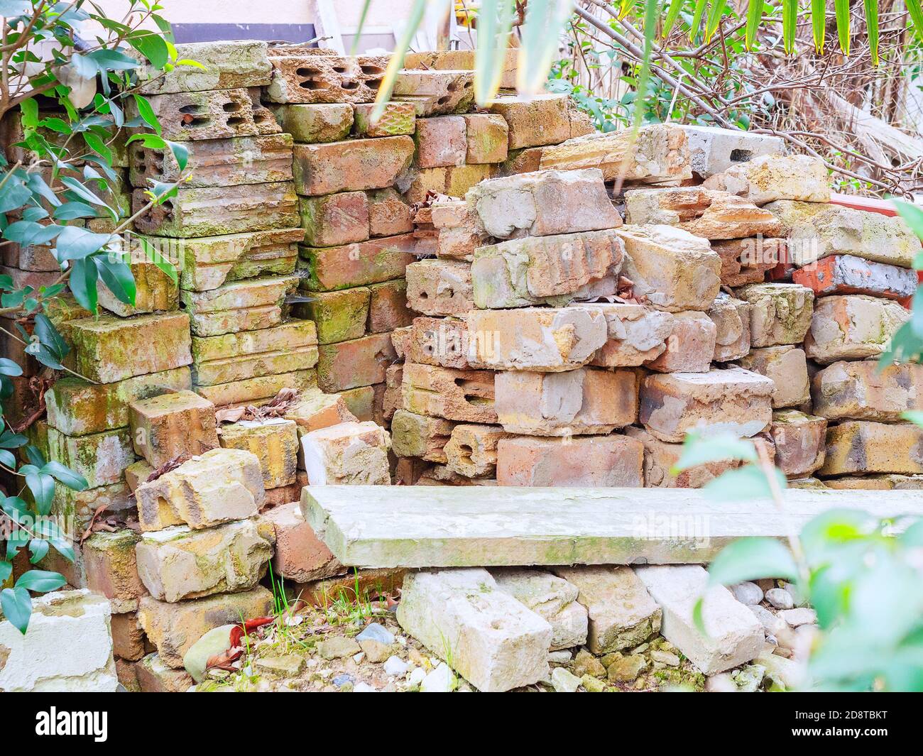 A pile of old used bricks stacked on the street Stock Photo - Alamy