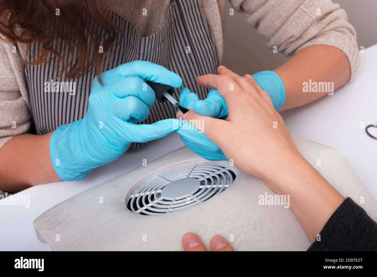 Girl getting a manicure hi-res stock photography and images - Alamy