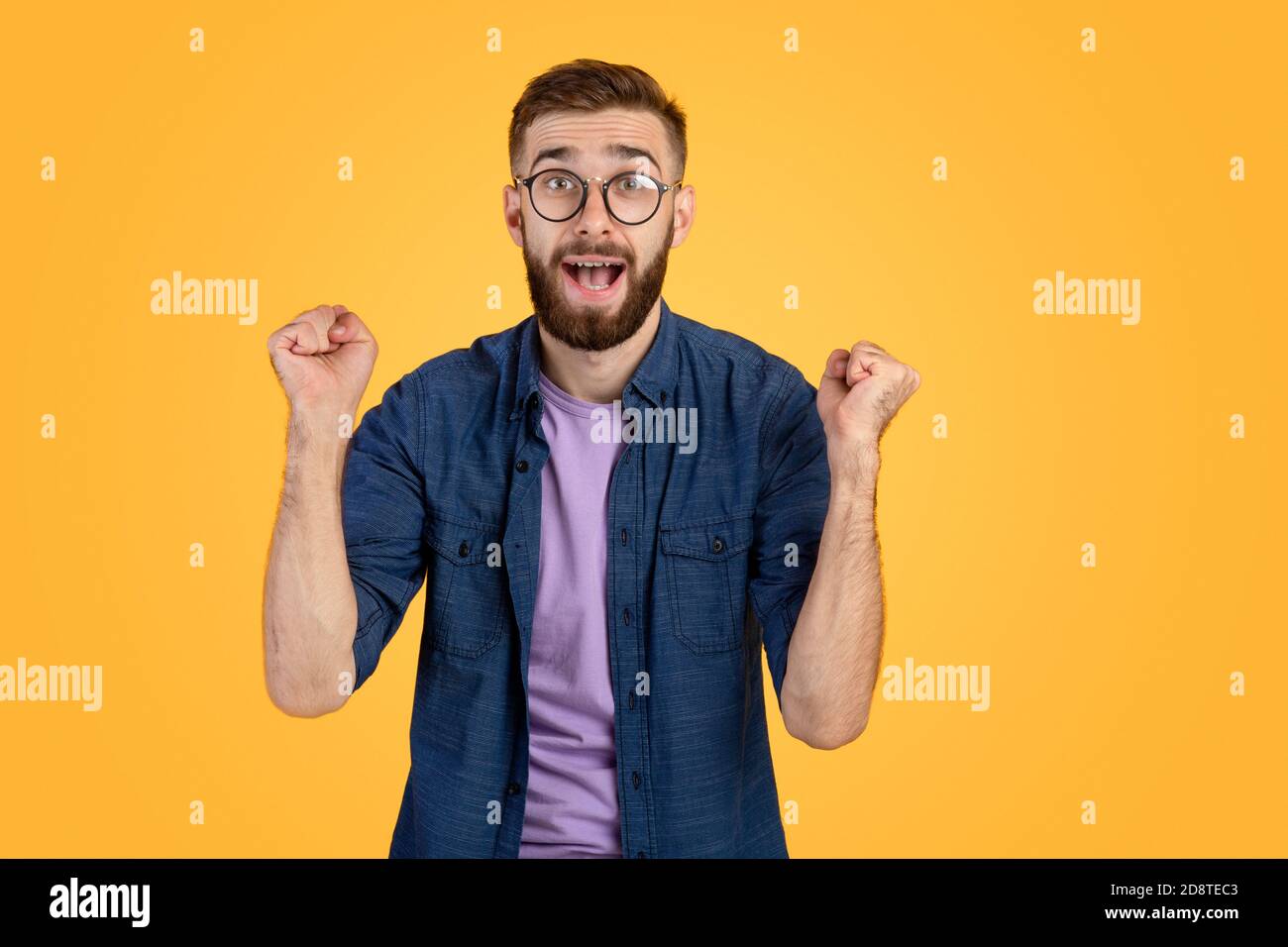 Winner and success concept. Excited young guy making YES gesture with ...