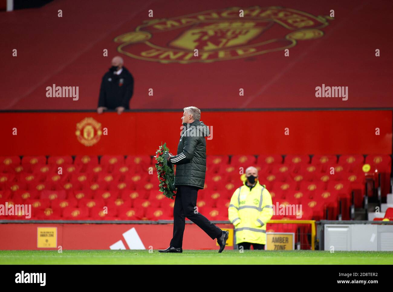 Manchester United manager Ole Gunnar Solskjaer with a poppy wreath ...