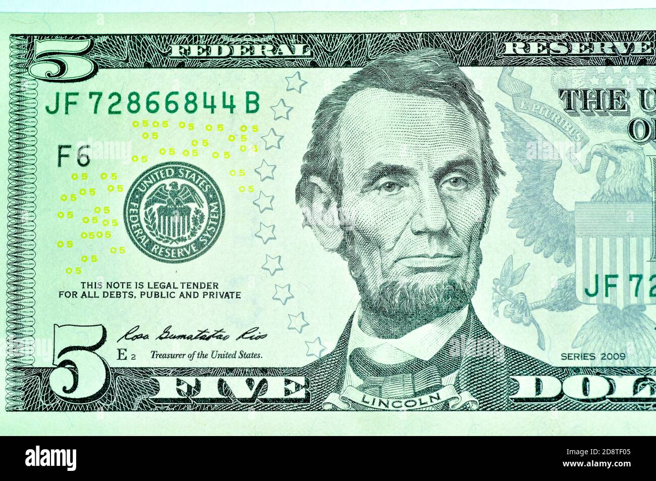 Top view shot of a five-dollar banknote isolated on a white background ...