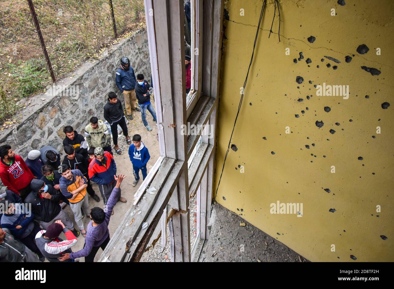 A view of a bullet riddled wall of a residential house where a top ...