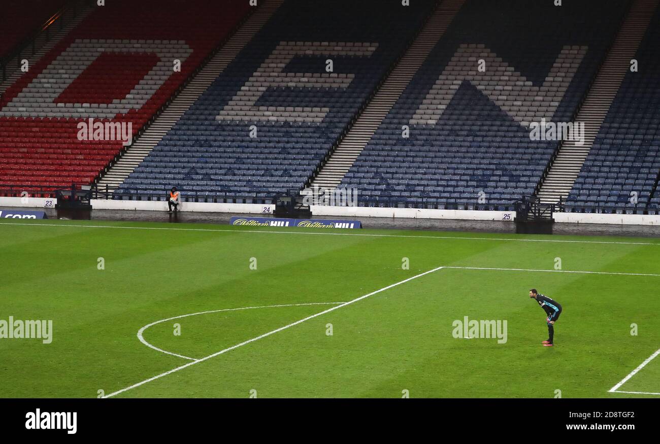 Aberdeen goalkeeper Joe Lewis looks on with empty seats in the ...