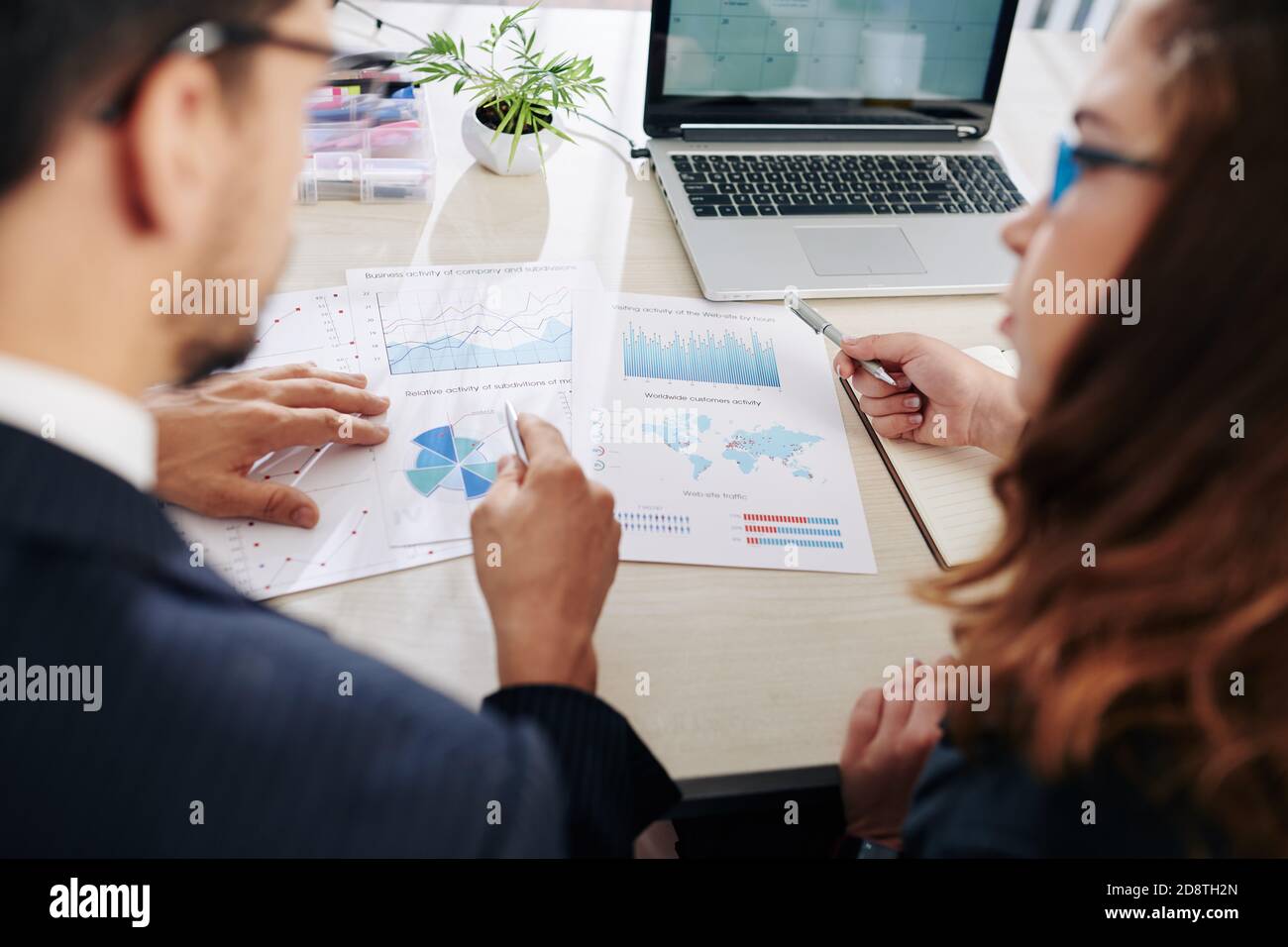 Business people discussing charts Stock Photo - Alamy