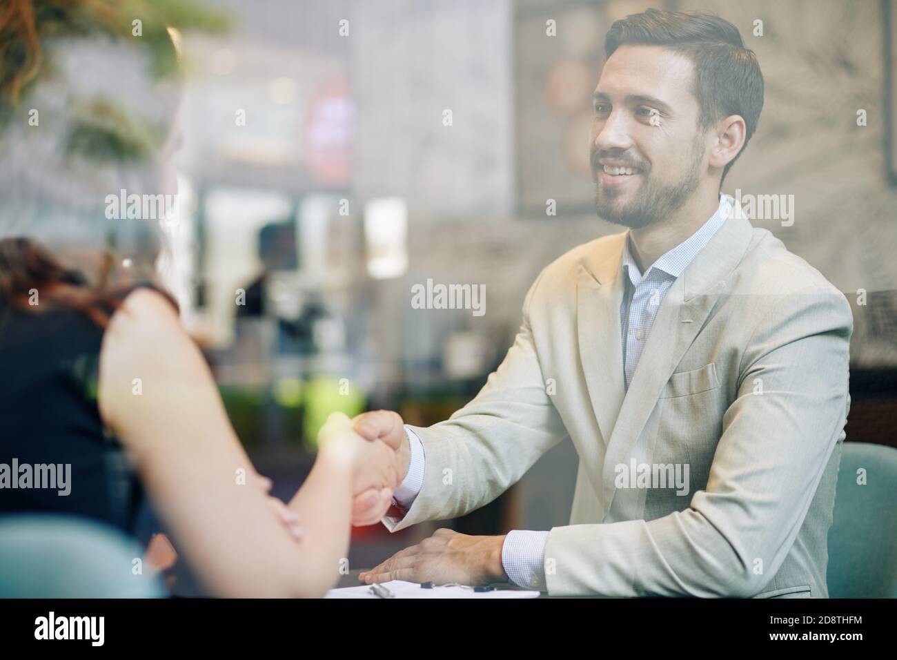 Greeting female business partner Stock Photo - Alamy