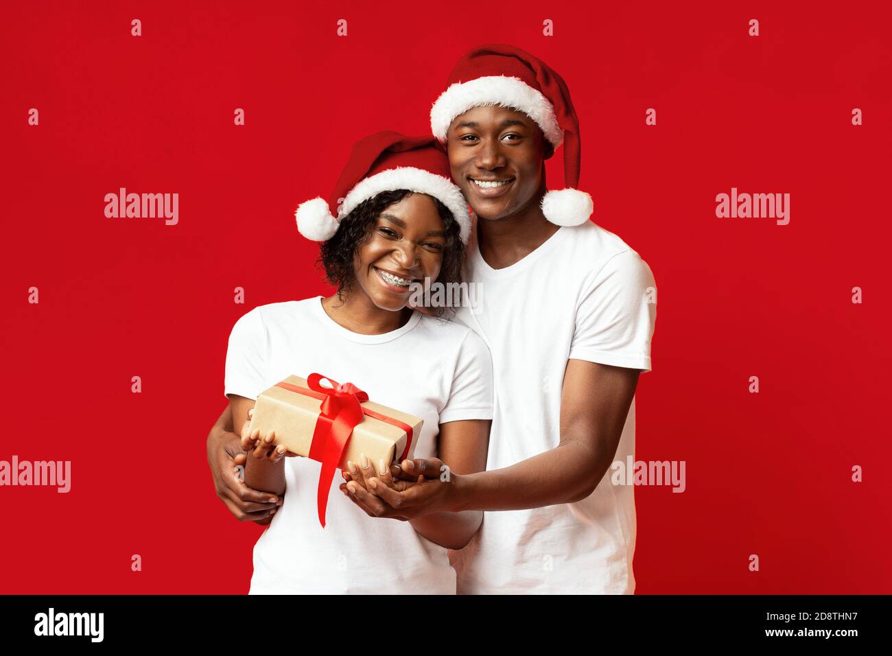 Christmas couple celebrating in hi-res stock photography and images - Alamy