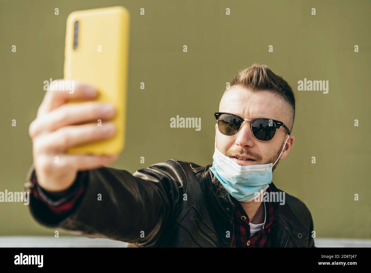 Confident man with big smile wearing open face protective mask during ...