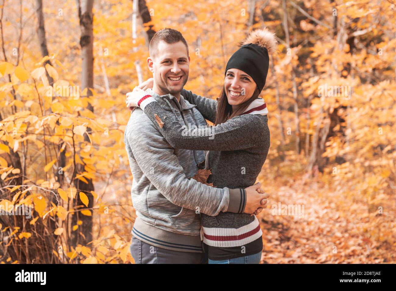happy autumn fall couple in a park Stock Photo - Alamy