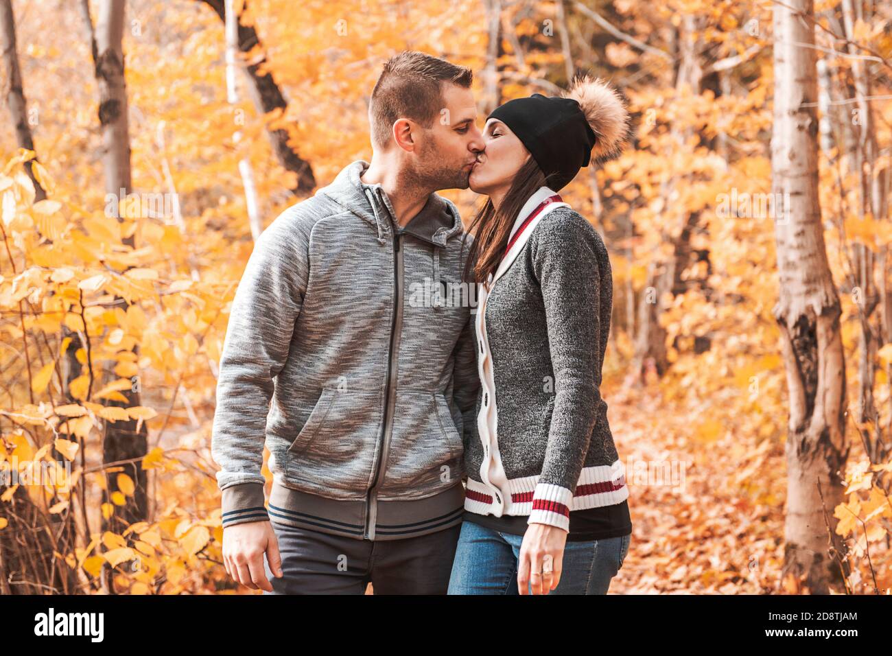happy autumn fall couple in a park Stock Photo - Alamy