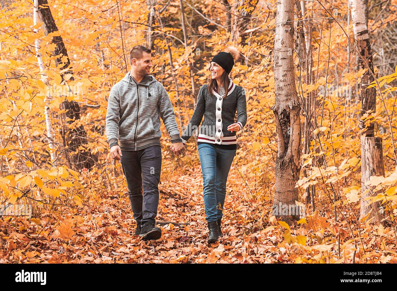 happy autumn fall couple in a park Stock Photo - Alamy