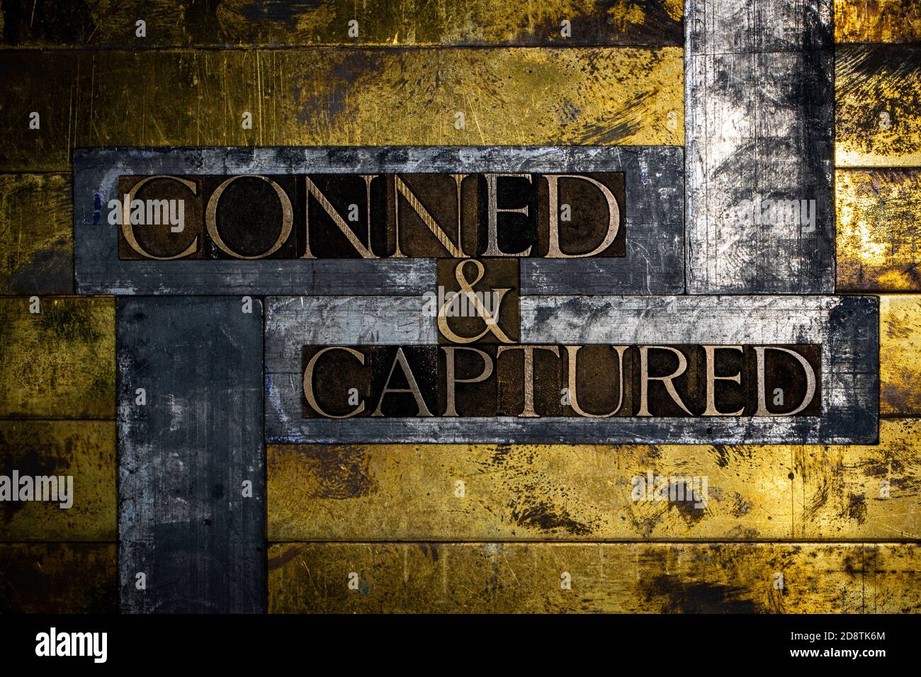 Conned and Captured text message on vintage textured grunge copper and ...