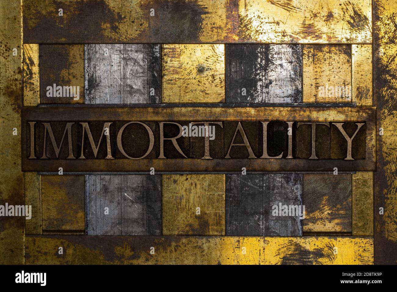Immortality text message on textured grunge copper and vintage gold ...