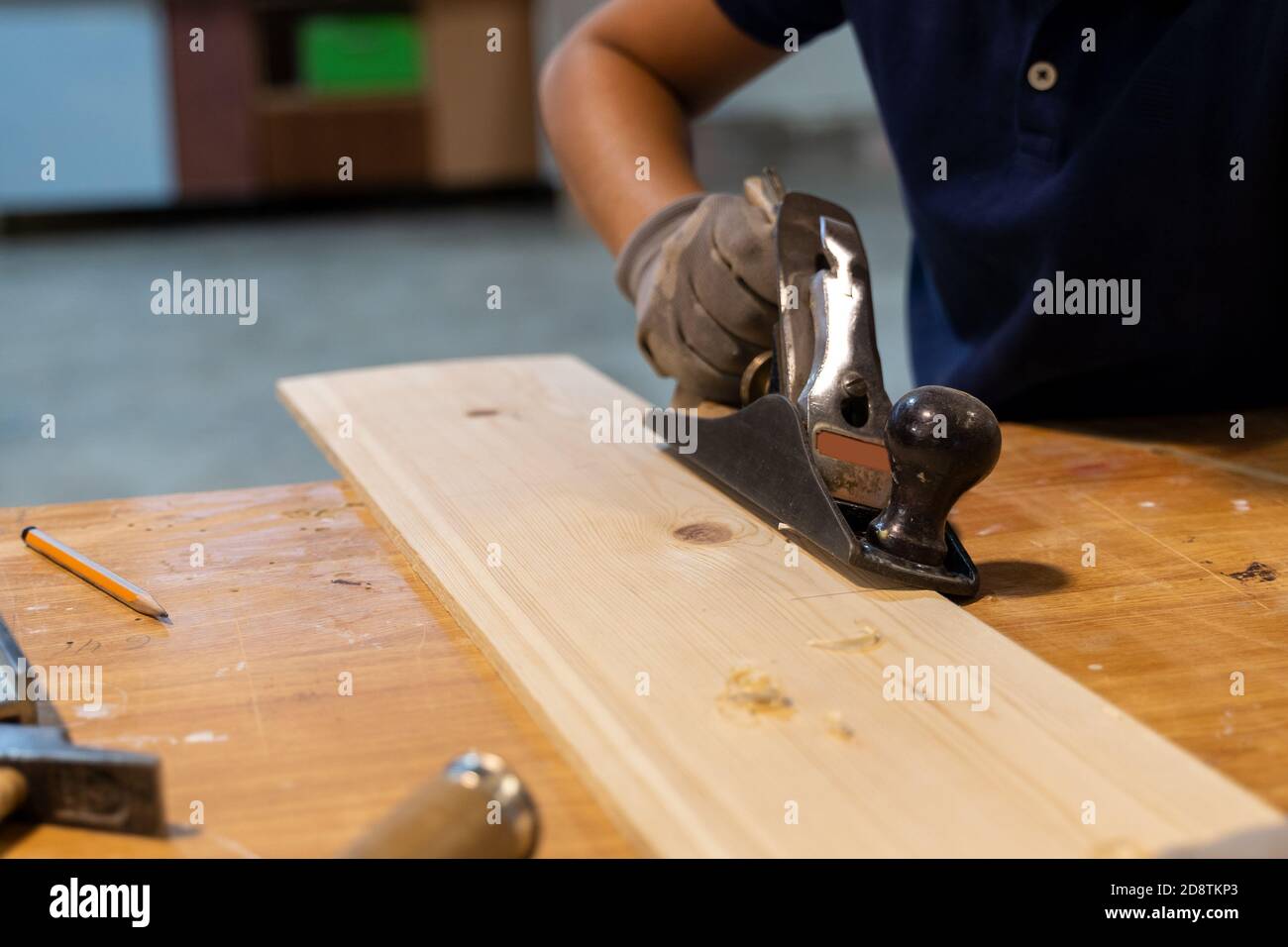 Boy sanding wood in a carpentry Stock Photo - Alamy