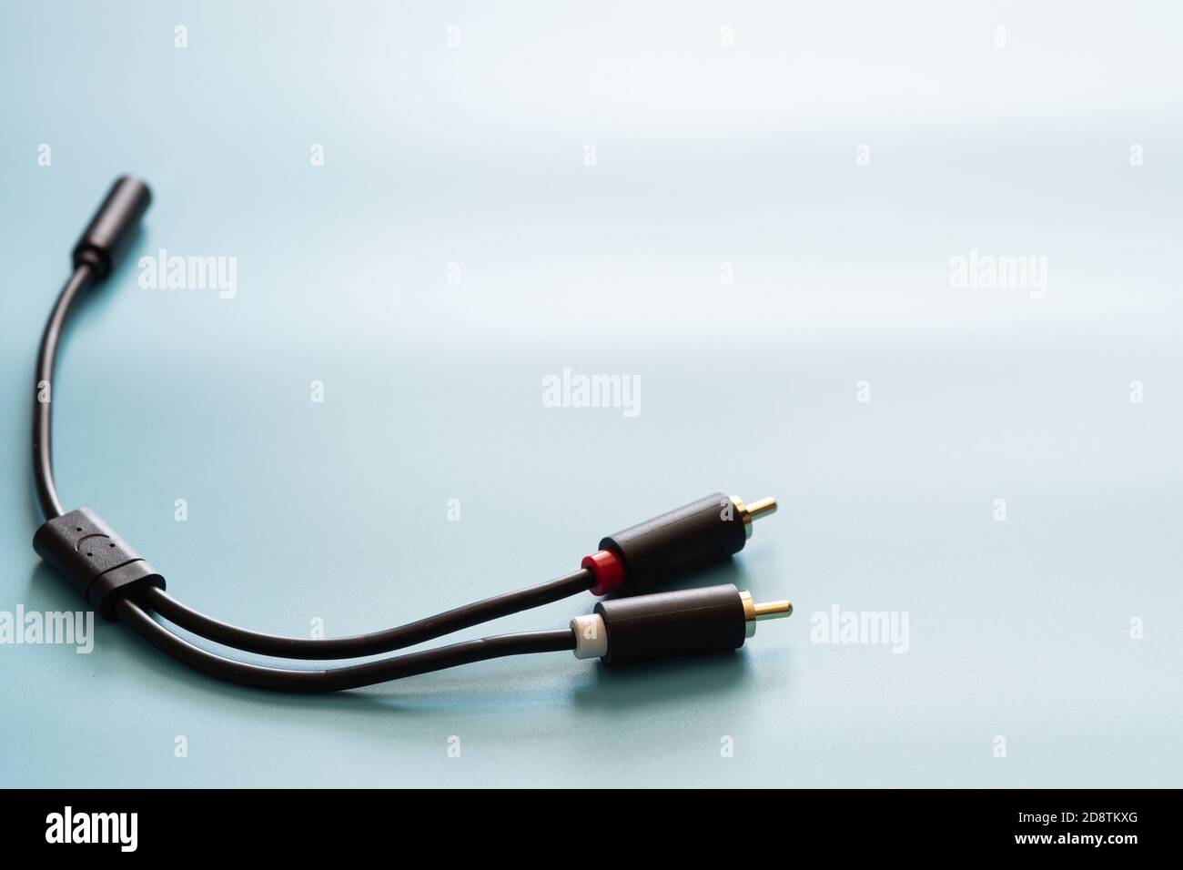 AV splitter cable connector and copy space on blue background color ...