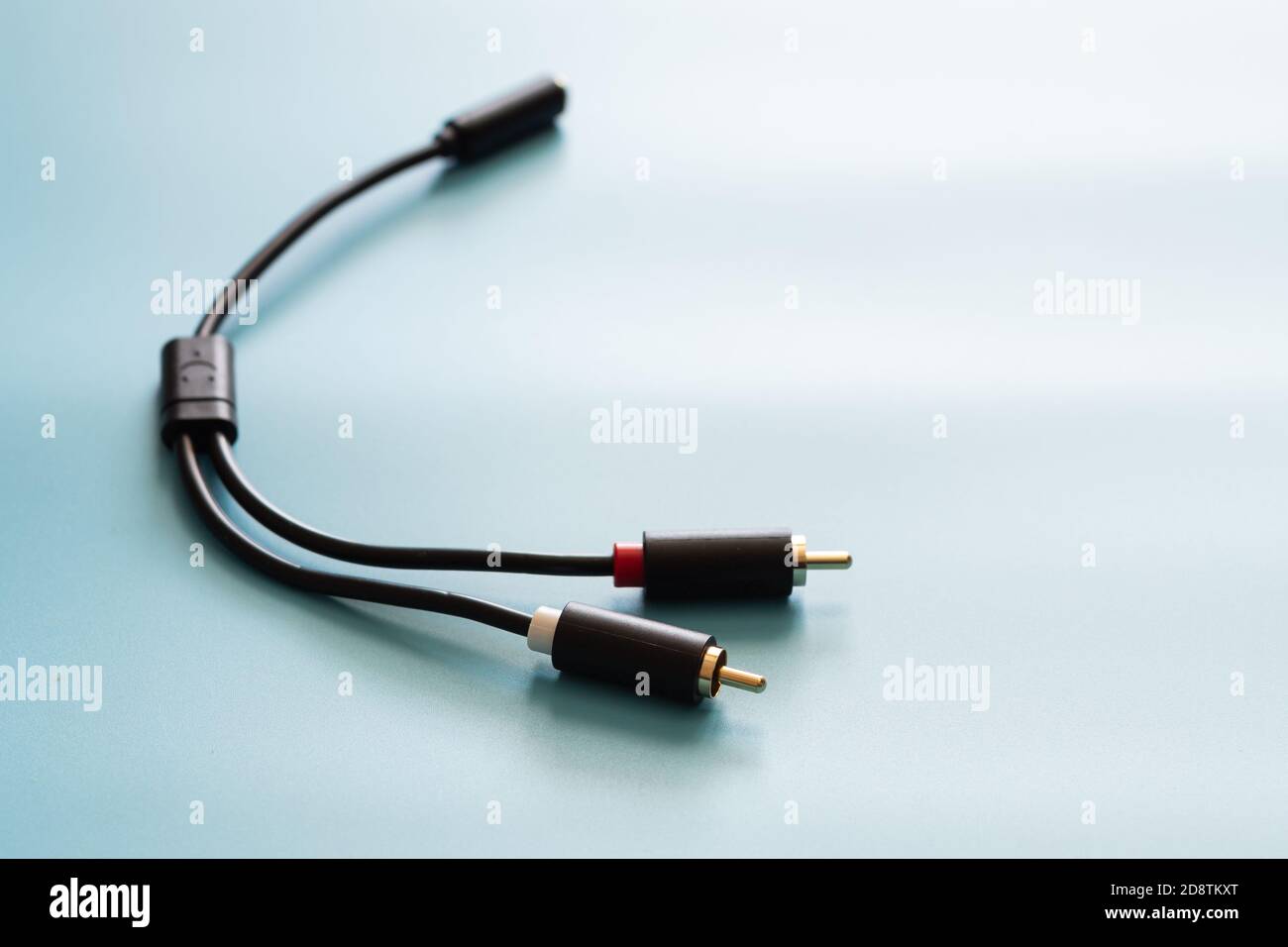 AV splitter cable connector and copy space on blue background color ...