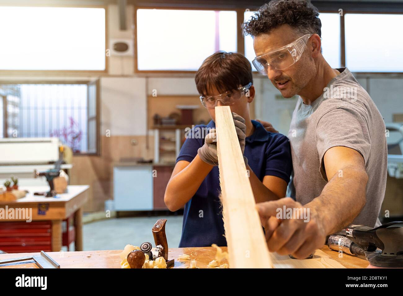Father son carving together hi-res stock photography and images - Alamy