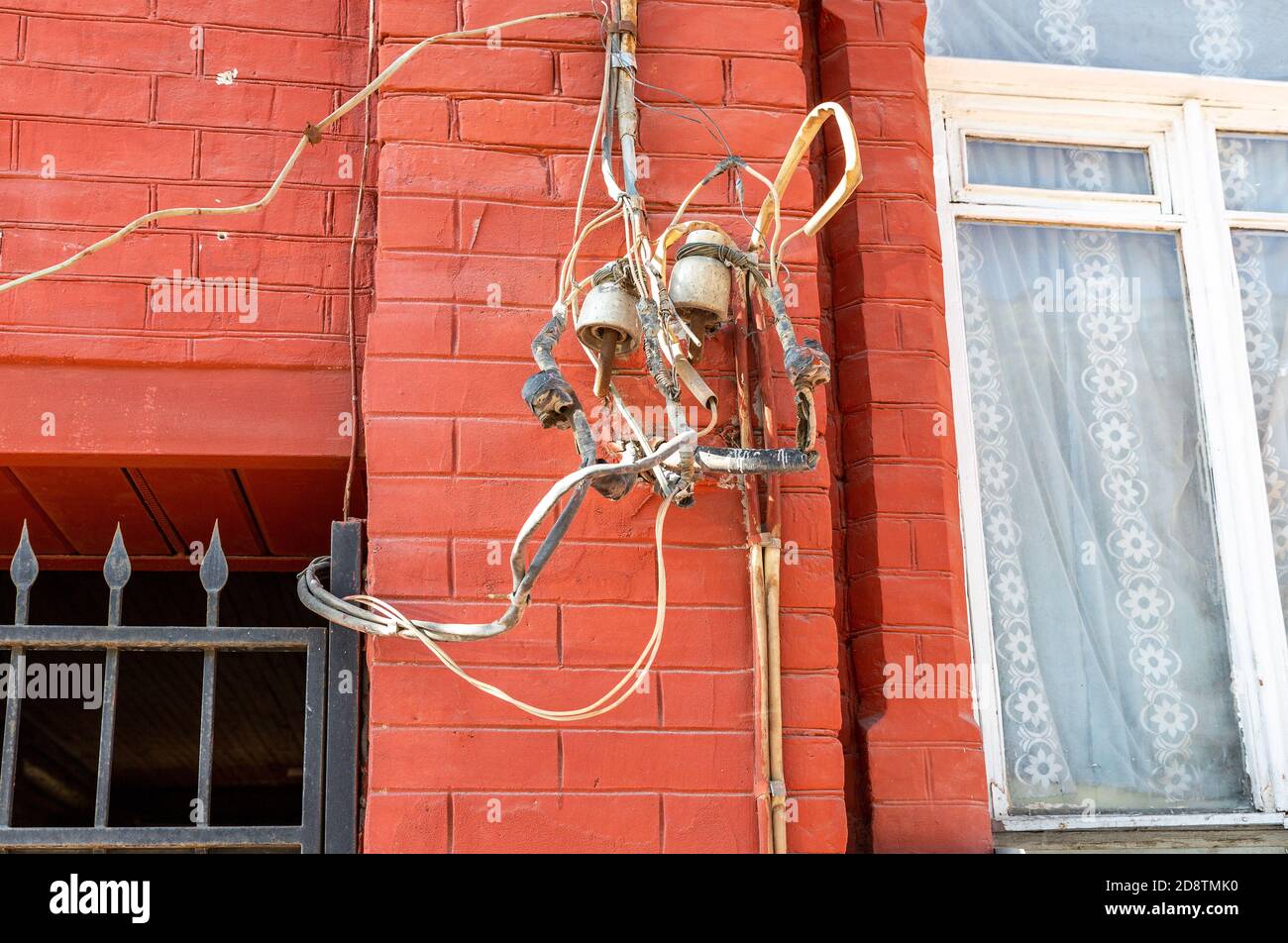 Electrical equipment and high voltage wiring lines on the wall of old ...