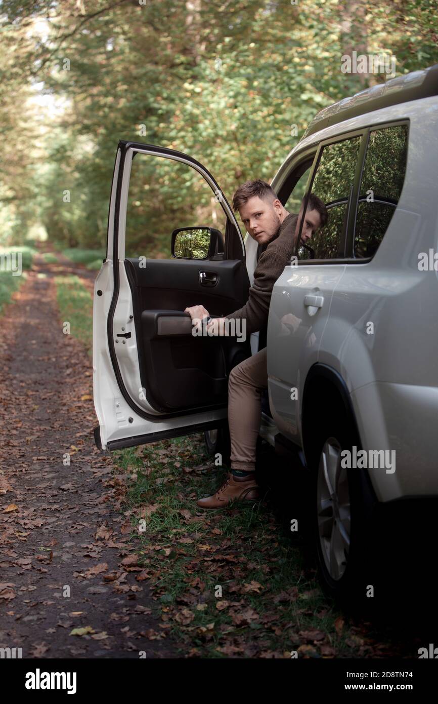 Man goes out car hi-res stock photography and images - Alamy