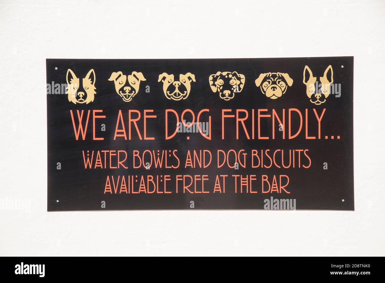 England, UK. 2020. Dog friendly pub sign on the wall of a pub Stock ...