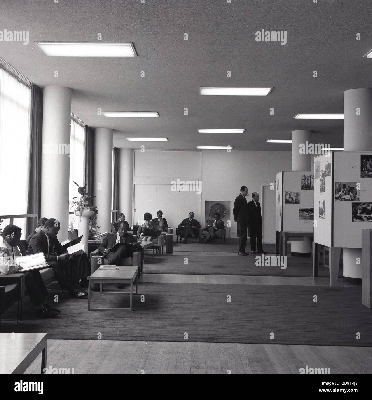 1960s, historical, overseas visitors waiting in a visitors reception or ...