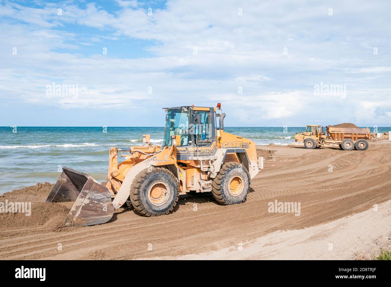 front loader working, beach restoration, placement of sand, in Ebro ...