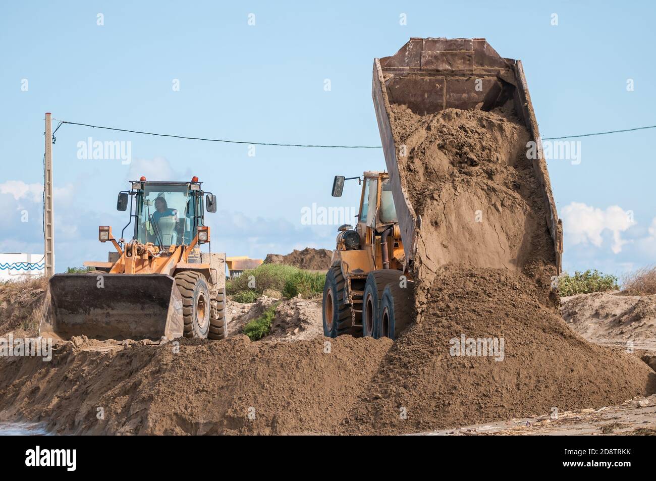 Dump truck unloading sand hi-res stock photography and images - Alamy
